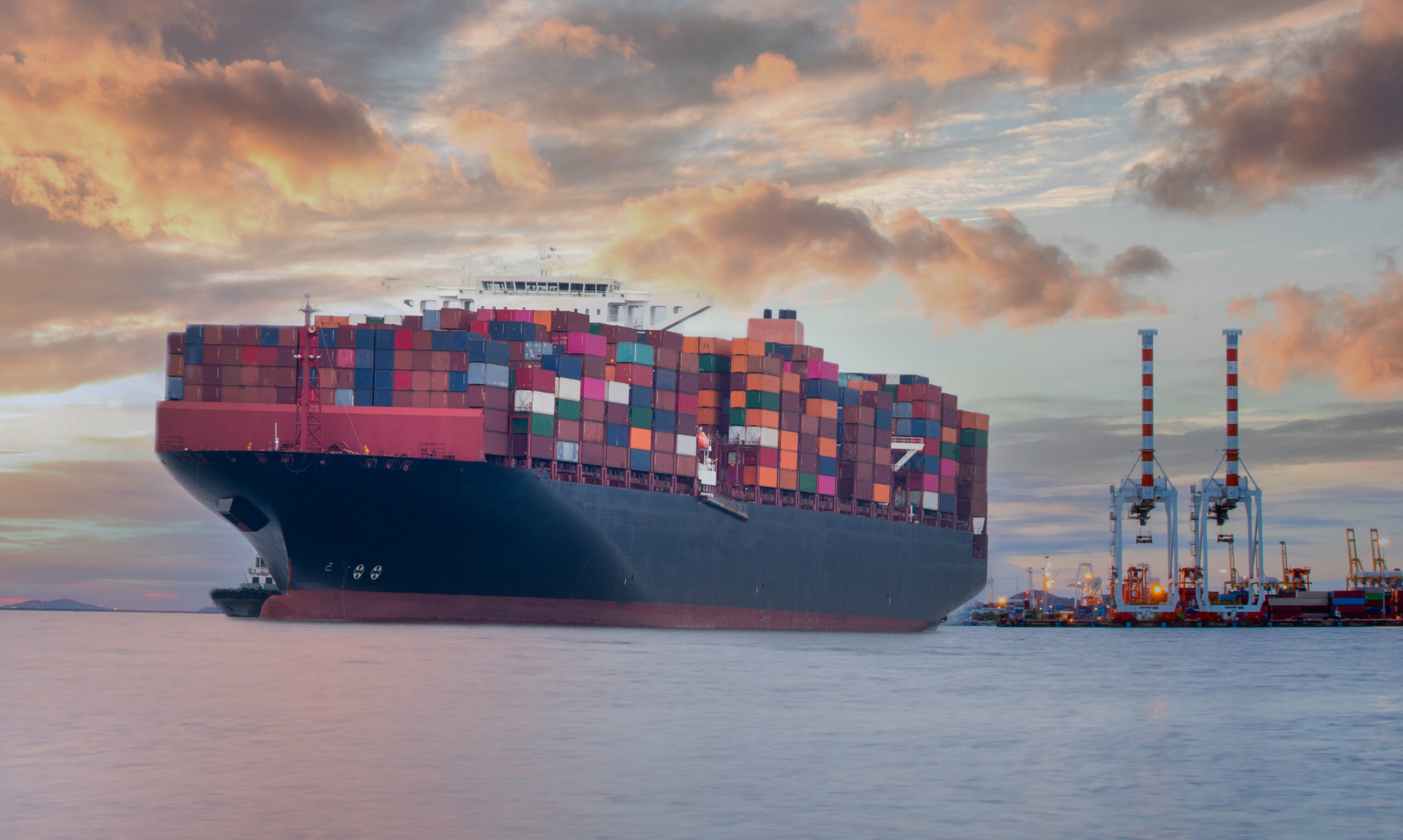 Logistics and container loading by large barges by sea in a harbor full ...